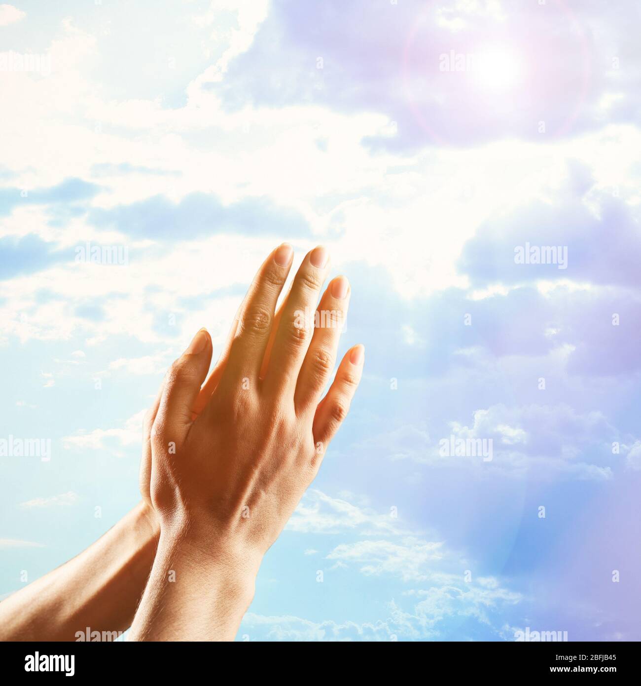 Human hands on sky background Stock Photo - Alamy