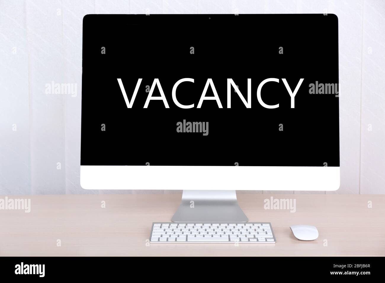 Office workplace with vacancy sign Stock Photo - Alamy