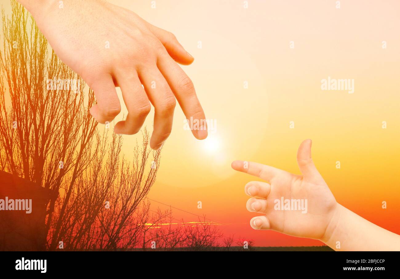 Child and father hands on nature background Stock Photo - Alamy