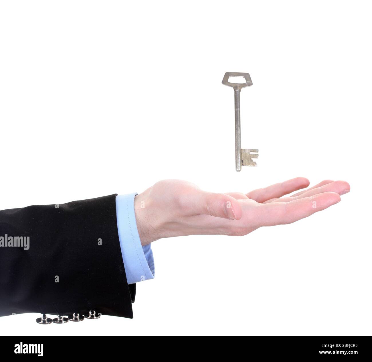 Business man hand with key isolated on white Stock Photo - Alamy