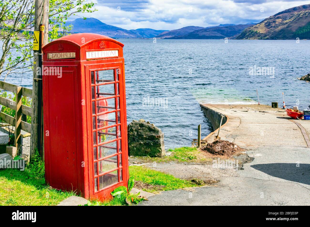 Red telephone boxby the slipway in Stromeferry on Loch Carron in ...