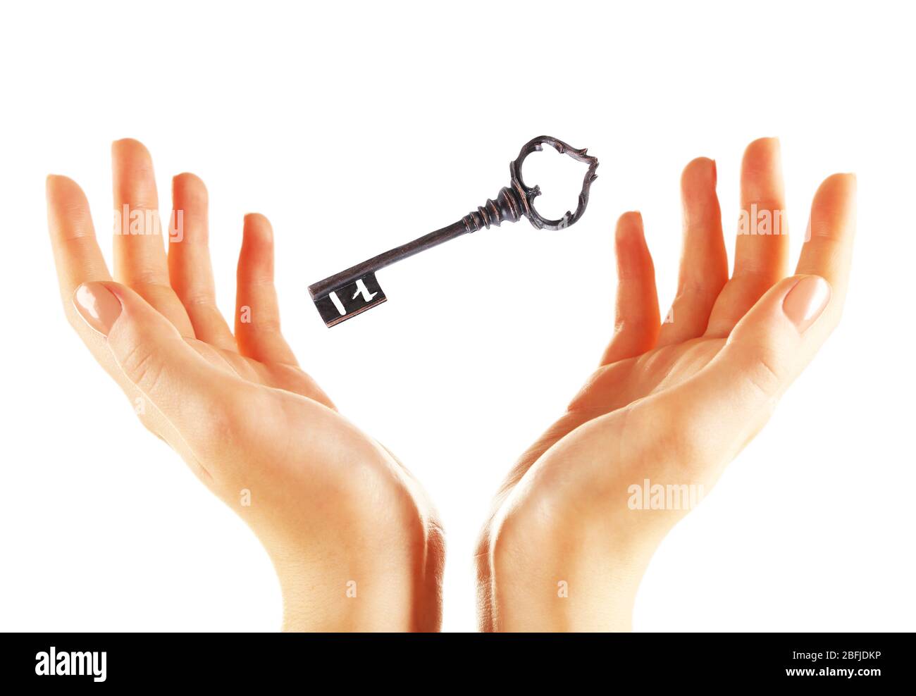 Female hands with key isolated on white Stock Photo - Alamy