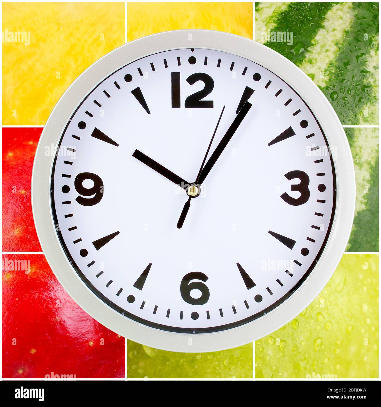 Food clock with vegetables and fruits as background. Healthy food ...
