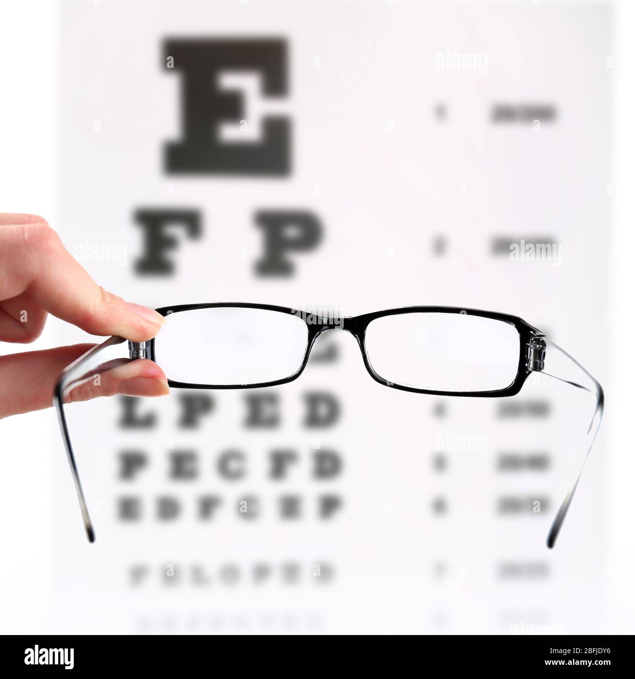 Eye glasses on eyesight test chart background Stock Photo - Alamy