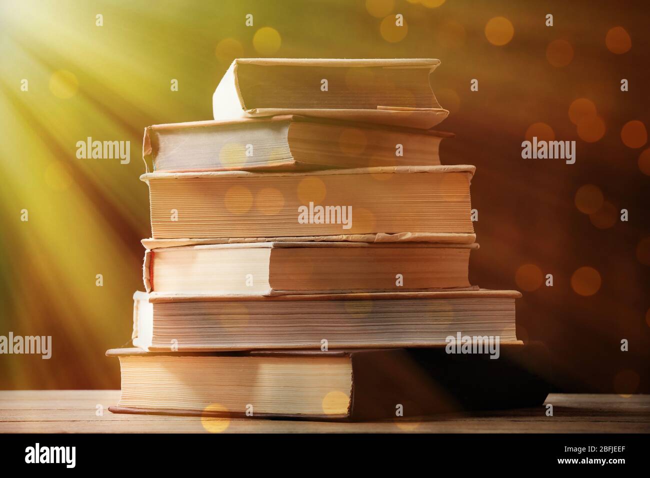 Books on lights background Stock Photo - Alamy