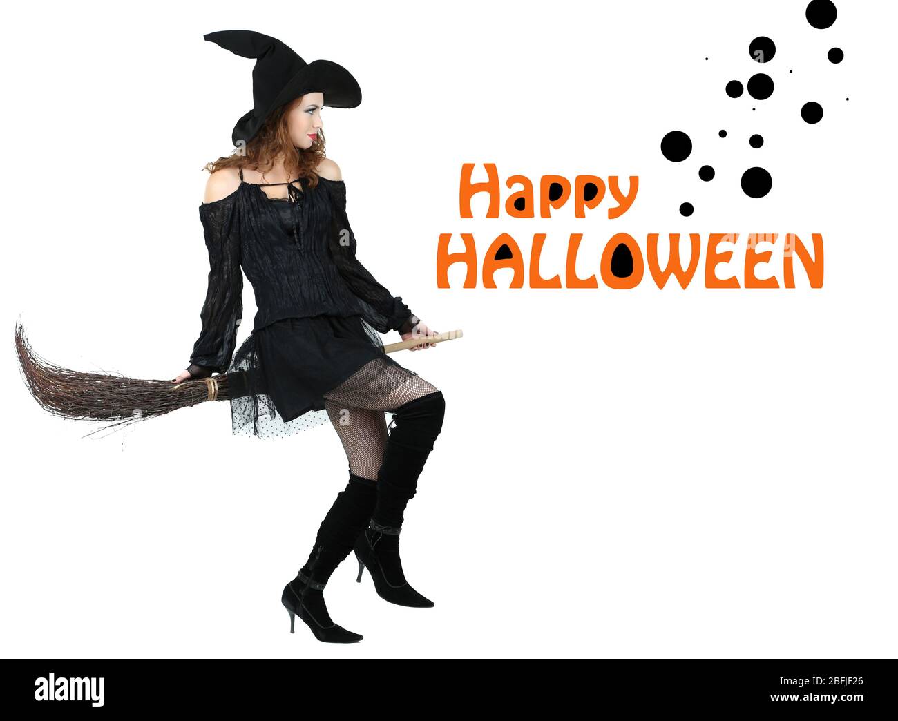 Halloween witch with broom isolated on white Stock Photo - Alamy