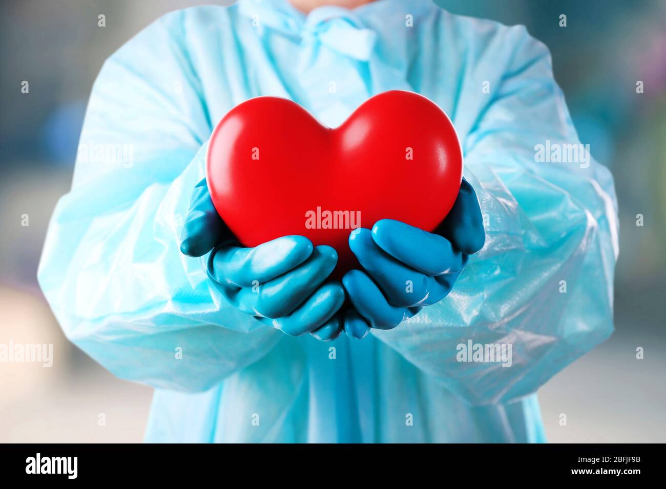 Doctor with heart in hospital Stock Photo - Alamy
