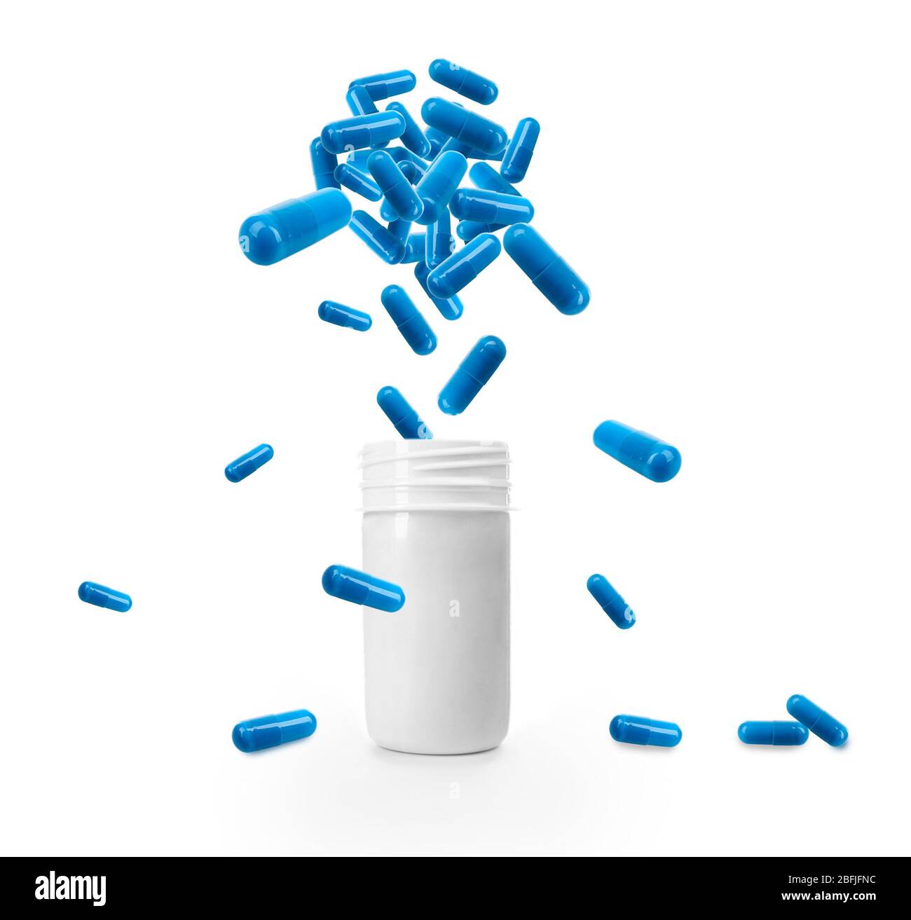 Medical pills falling into glass jar, isolated on white Stock Photo - Alamy