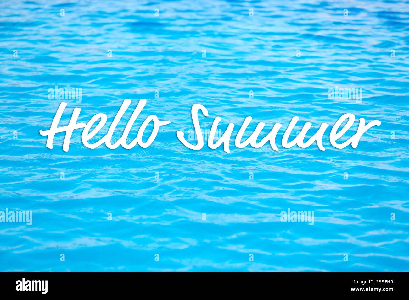 Hello summer concept. Blue water in swimming pool Stock Photo - Alamy