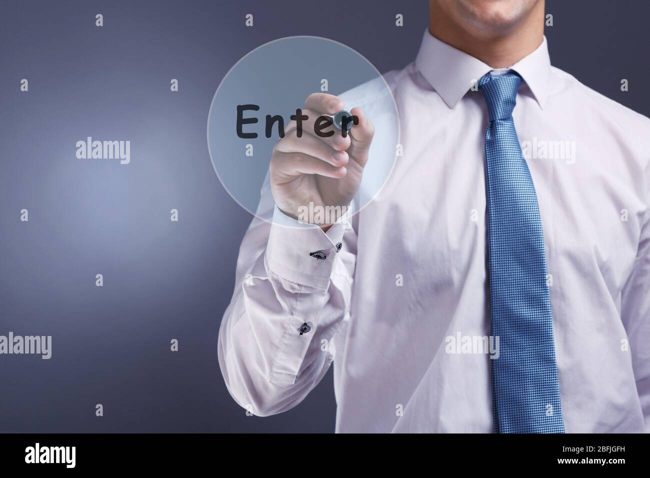 Young businessman push "Enter" button Stock Photo - Alamy
