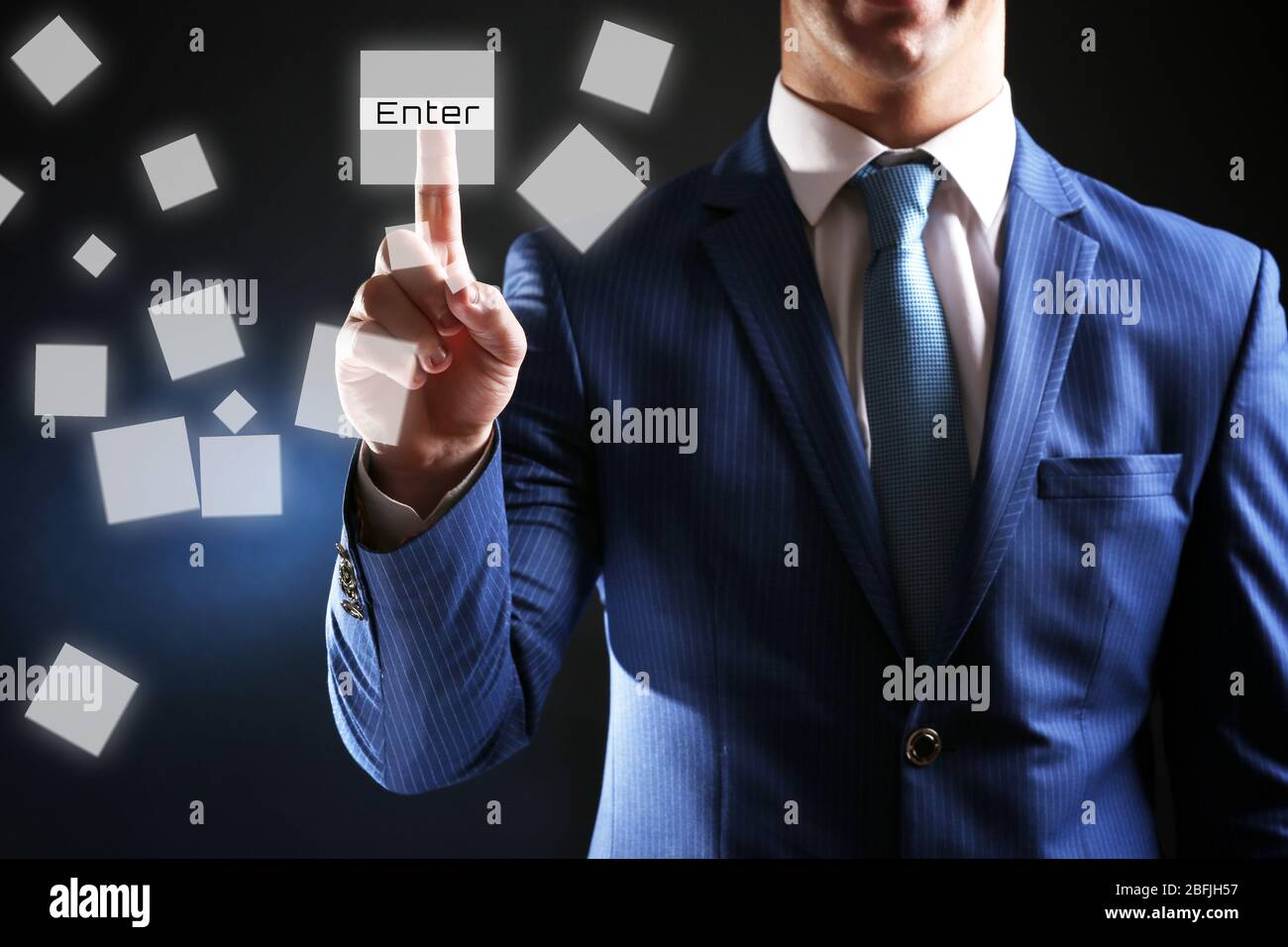 Young businessman push "Enter" button Stock Photo - Alamy
