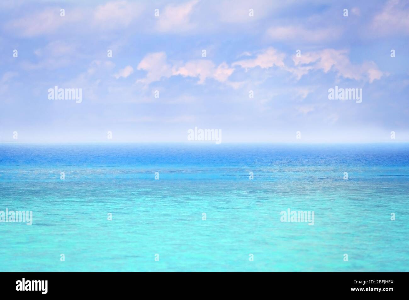Ocean water and beautiful sky background Stock Photo - Alamy