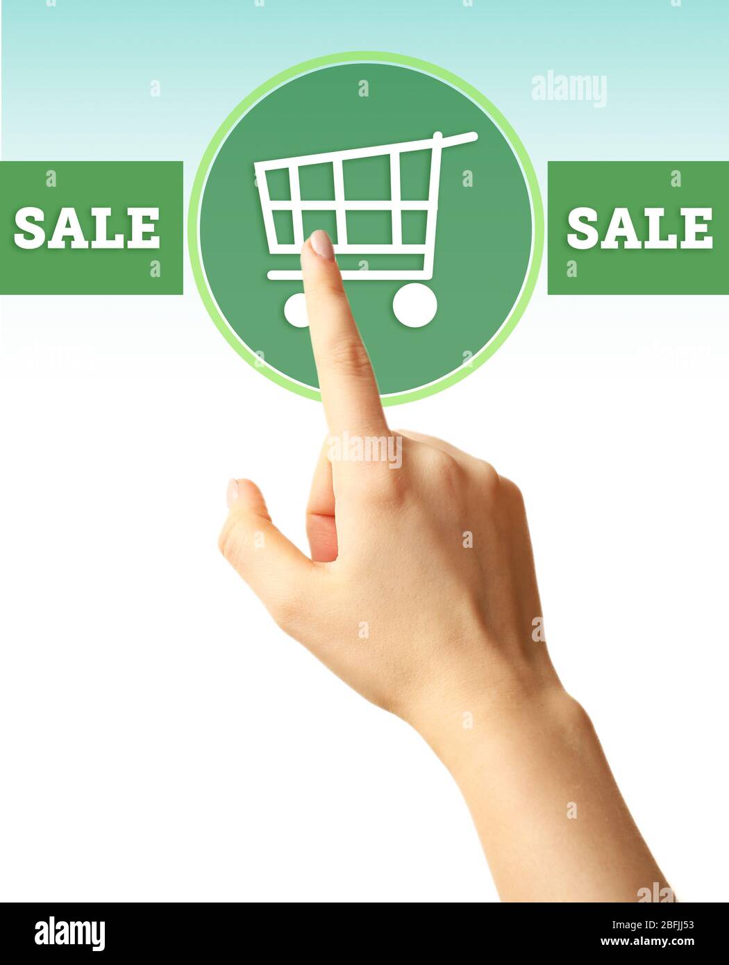 Female hand touching shopping cart symbol Stock Photo - Alamy