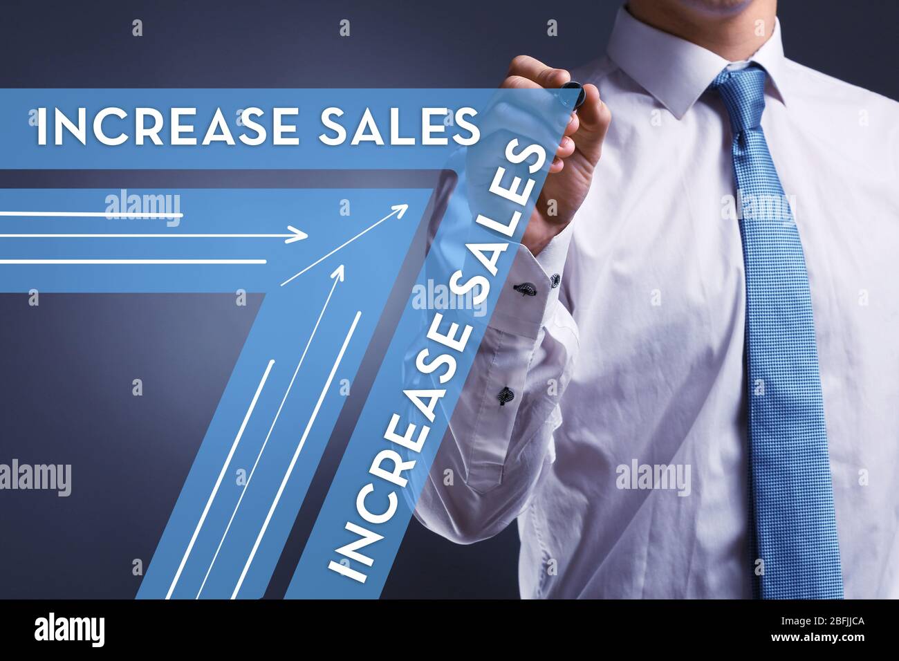 Increase sales concept. businessman drawing on screen Stock Photo - Alamy
