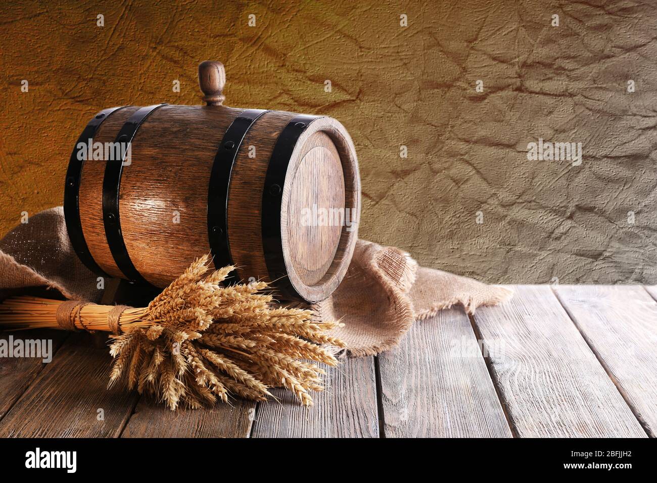 Old barrel with wheat on table Stock Photo - Alamy