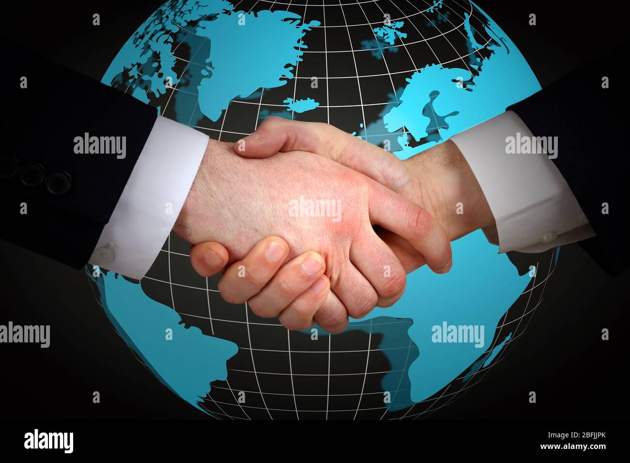 Business handshake on world map background Stock Photo - Alamy