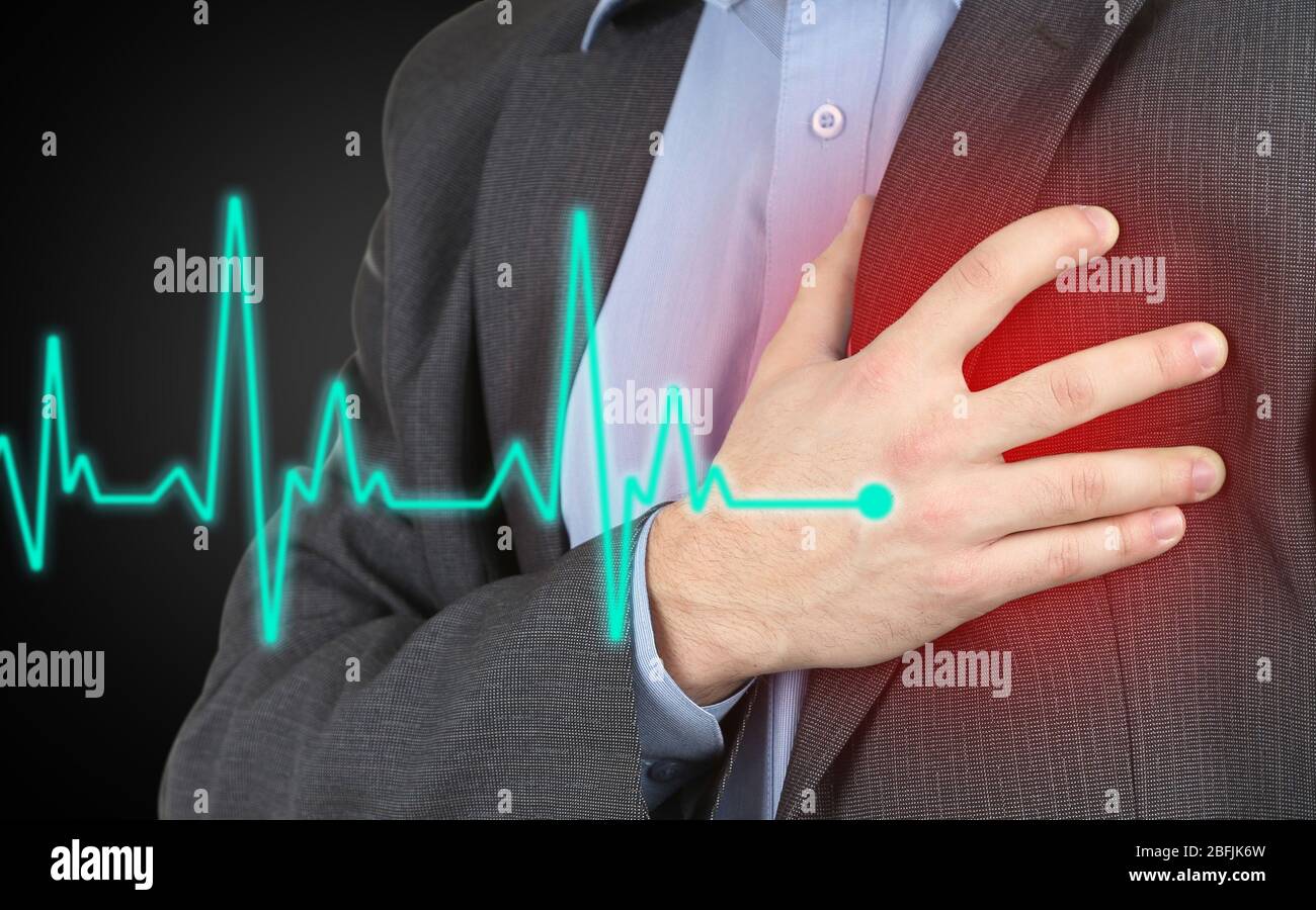 Man having chest pain - heart attack Stock Photo - Alamy