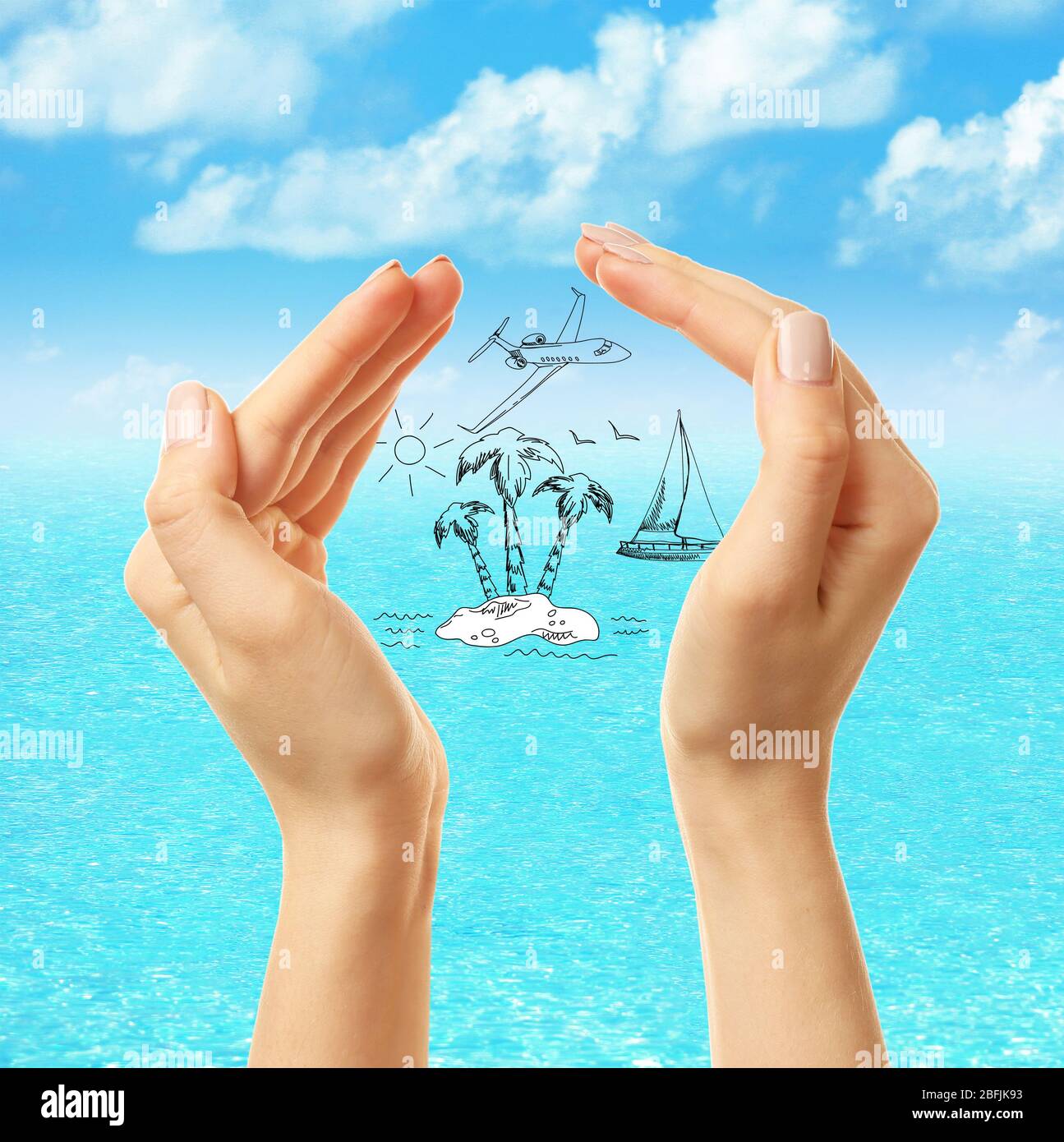 Female hands with drawings on ocean water background Stock Photo - Alamy