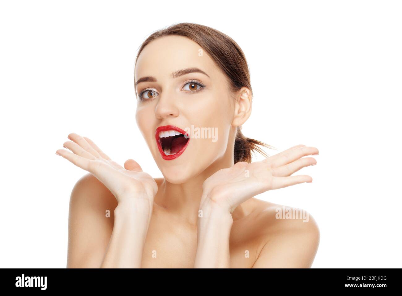 Surprised Young Woman Holding Hands At Open Mouth Expressing Delight