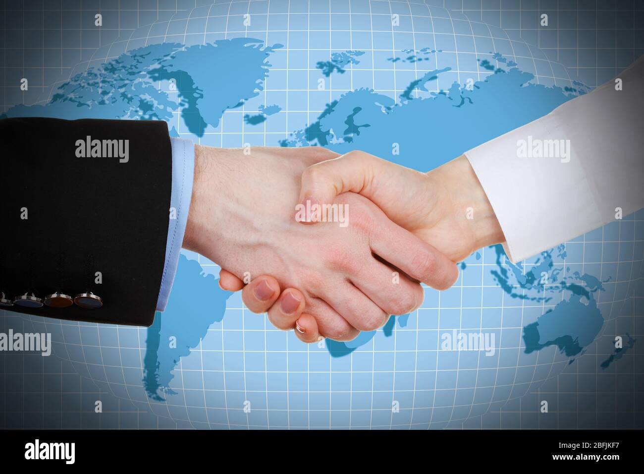 Business handshake on world map background Stock Photo - Alamy
