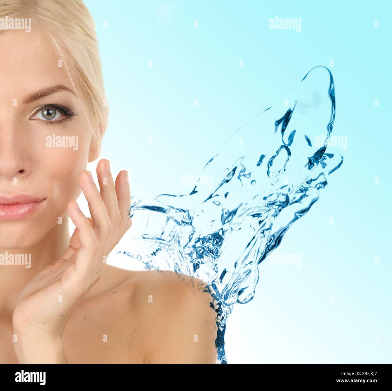 Beautiful young woman and water splash on blue background Stock Photo ...
