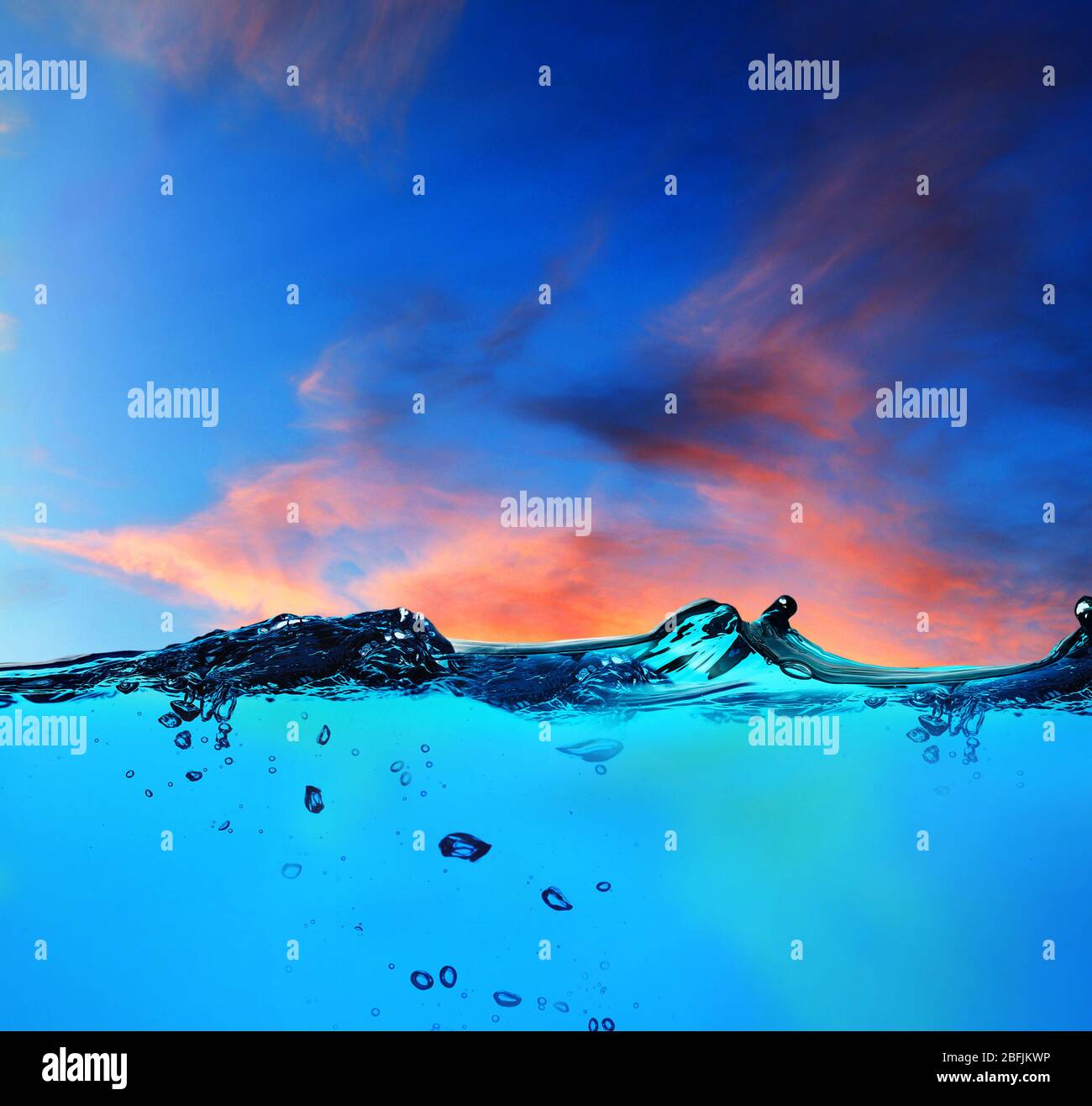 Water waves on sky background Stock Photo - Alamy