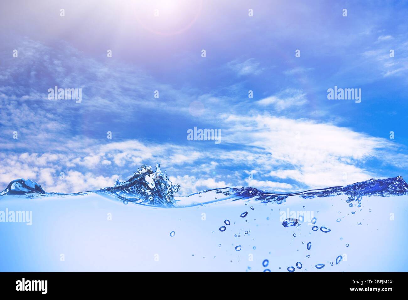 Water waves on sky background Stock Photo - Alamy