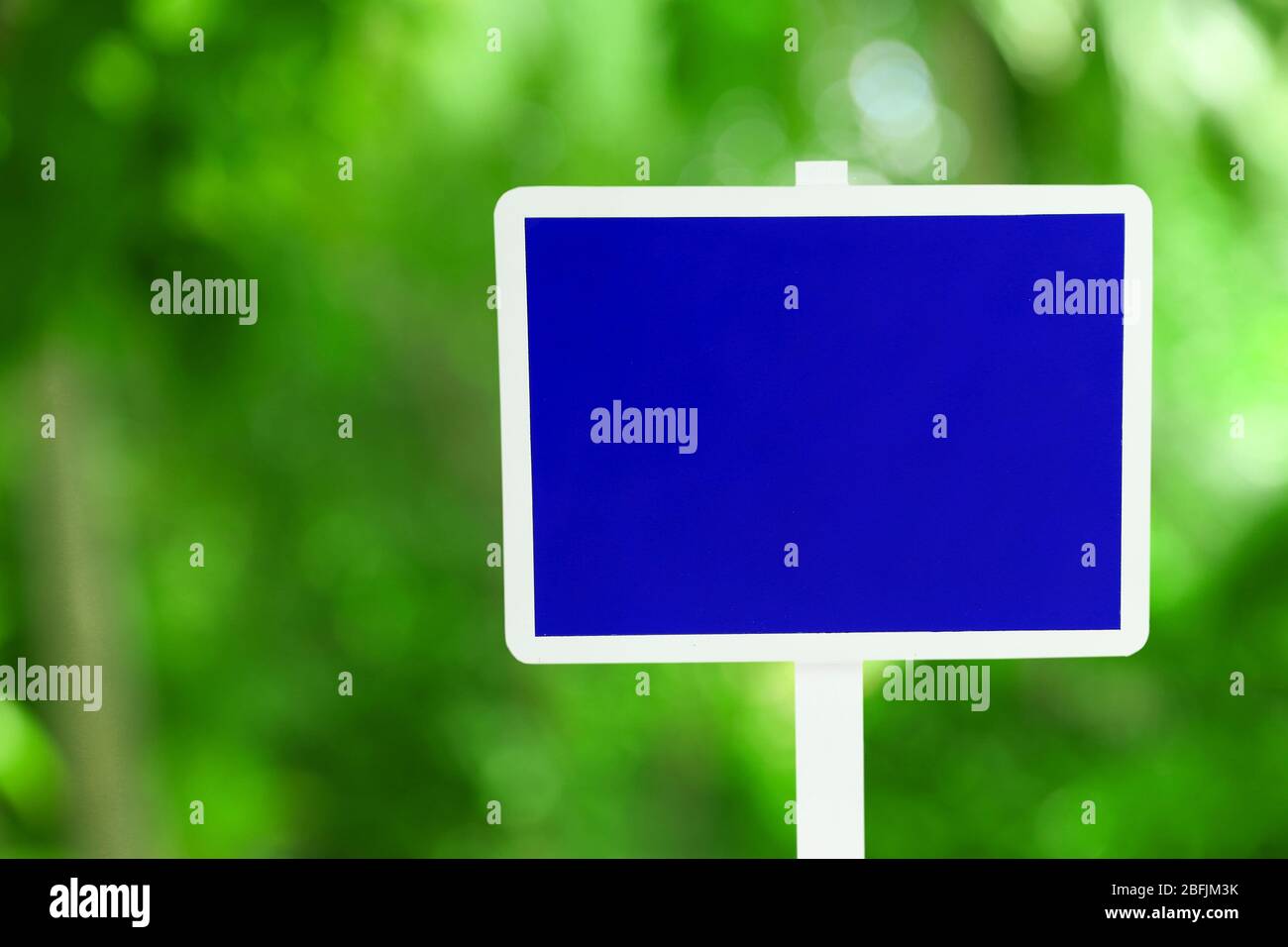 Wooden sign board on nature background Stock Photo - Alamy