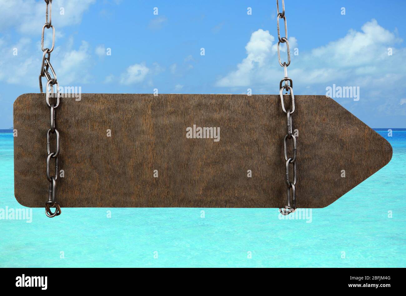 Wooden sign arrow on nature background Stock Photo - Alamy