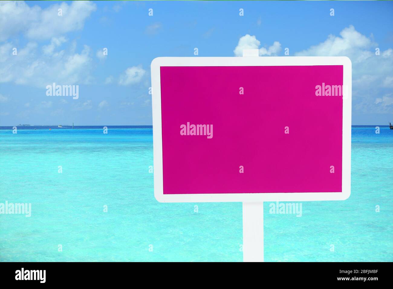 Wooden sign board on sea background Stock Photo - Alamy