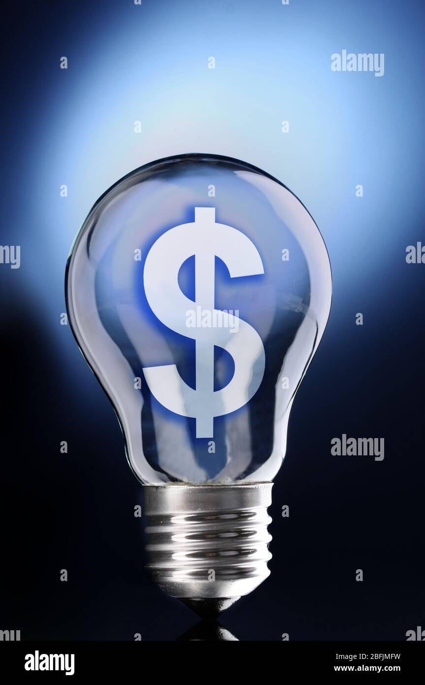 Light bulb with dollar symbol on dark background hi-res stock ...