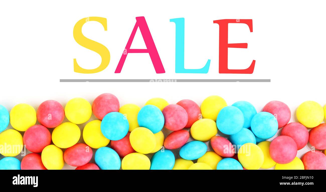 Sale concept. Color candies isolated on white Stock Photo - Alamy