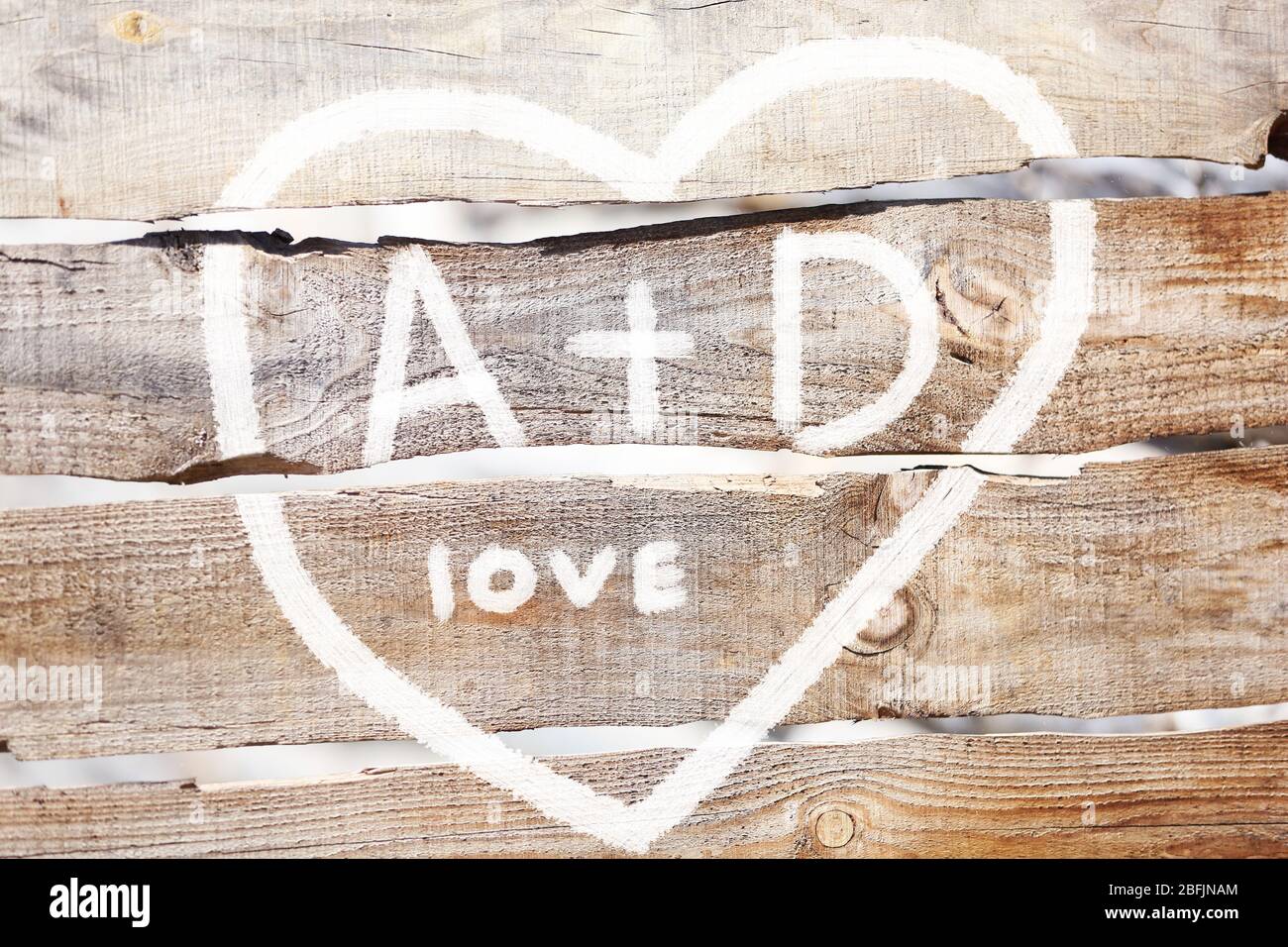 Love concept. Drawing on wooden wall background Stock Photo - Alamy