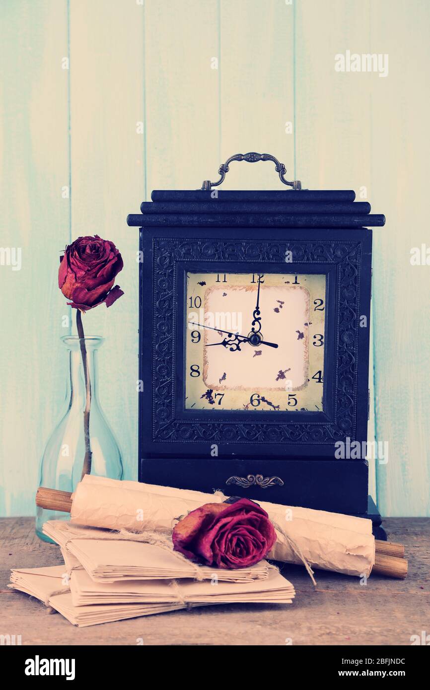 Still life with old retro clock Stock Photo - Alamy