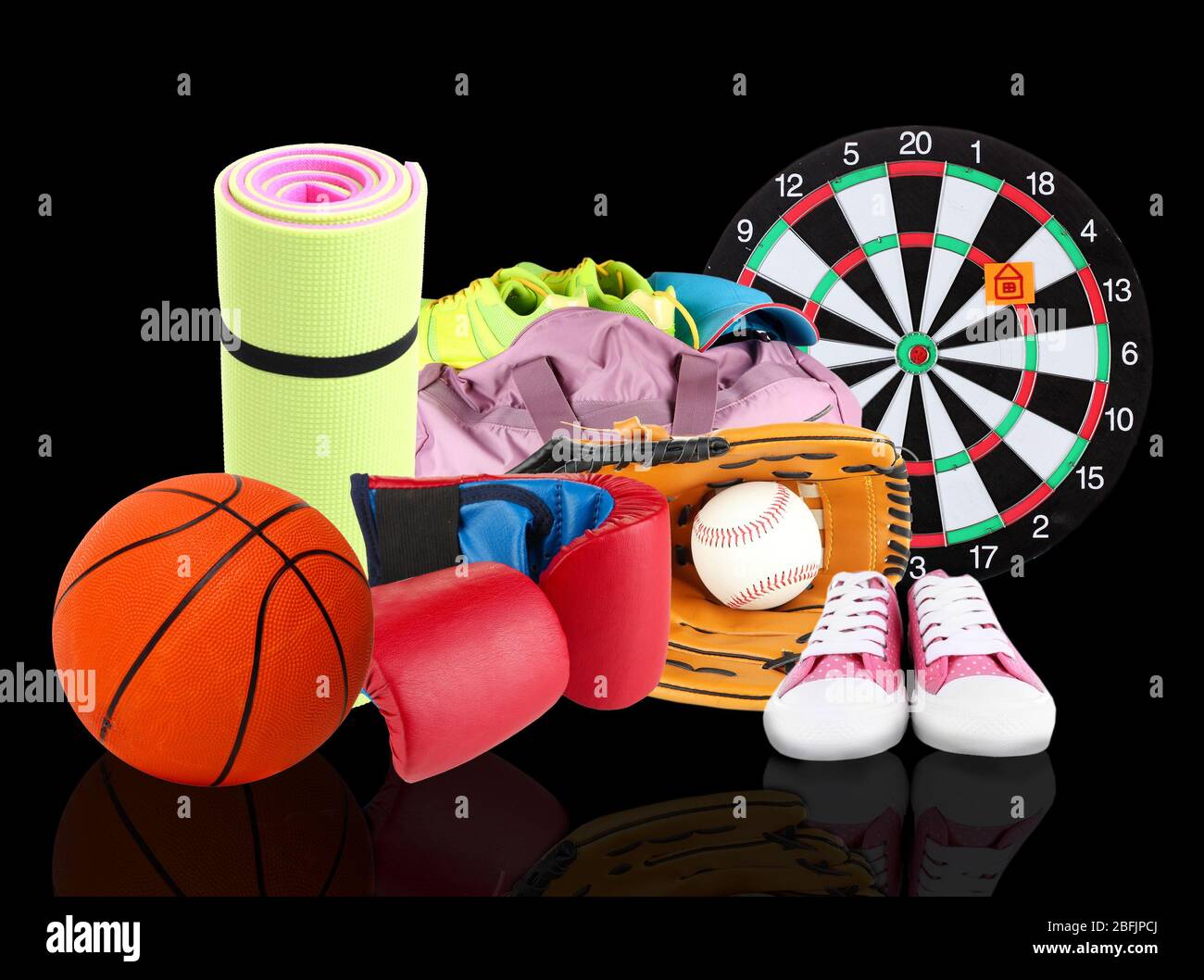 Sporting goods on black background Stock Photo - Alamy