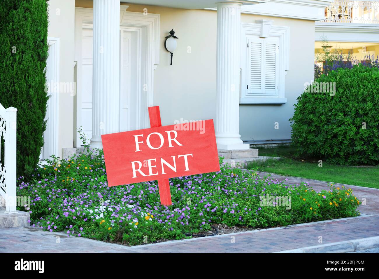 Real estate sign in front of new house for rent Stock Photo - Alamy