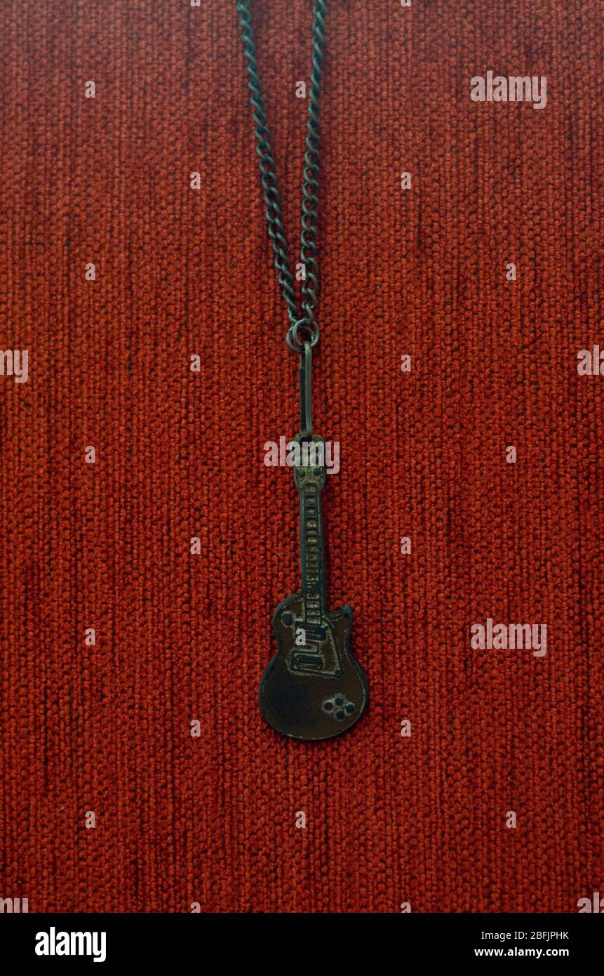 Guitar pendant necklace hi-res stock photography and images - Alamy