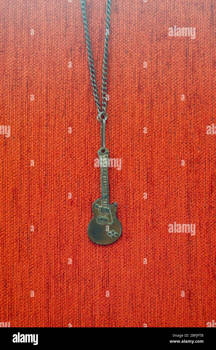 Guitar pendant necklace hi-res stock photography and images - Alamy