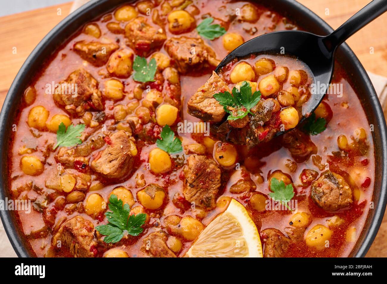 Moroccan Harira Soup in black bowl. Harira is Moroccan Cuisine dish ...