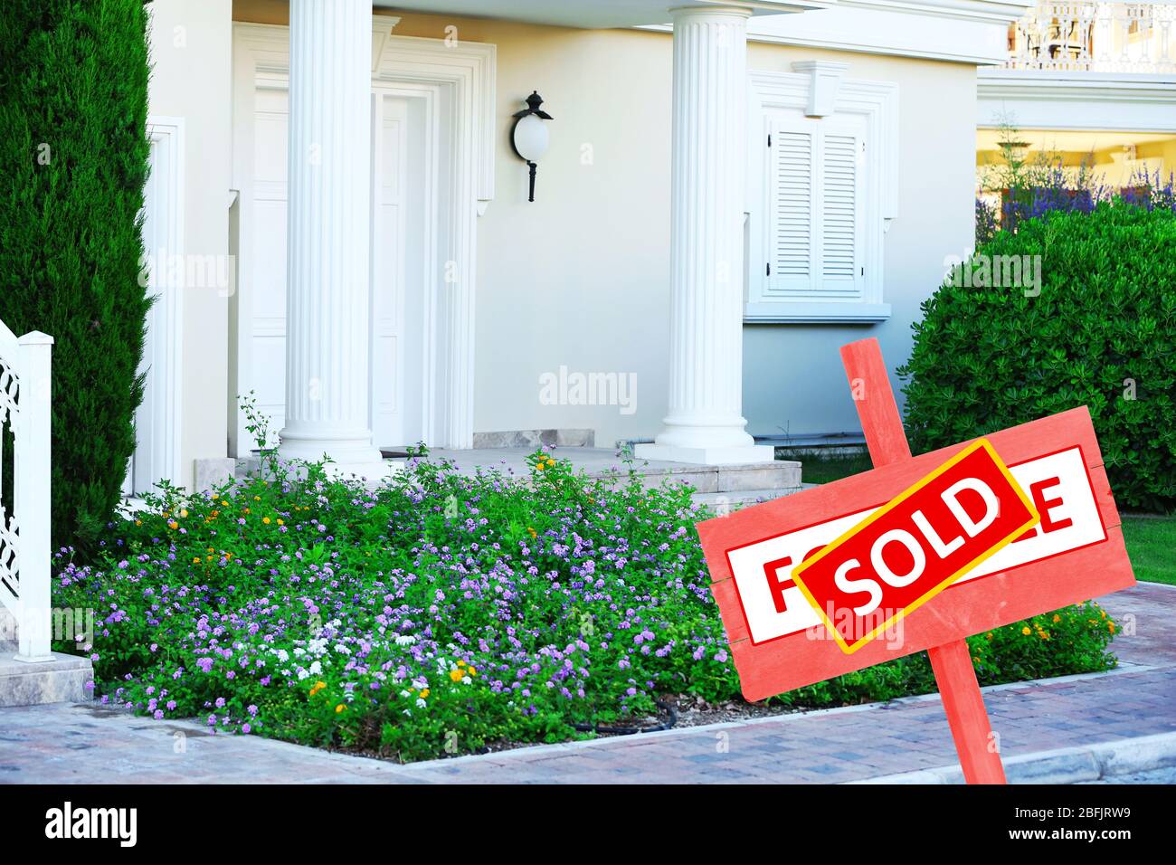 Sold home for sale real estate sign and beautiful new house Stock Photo ...