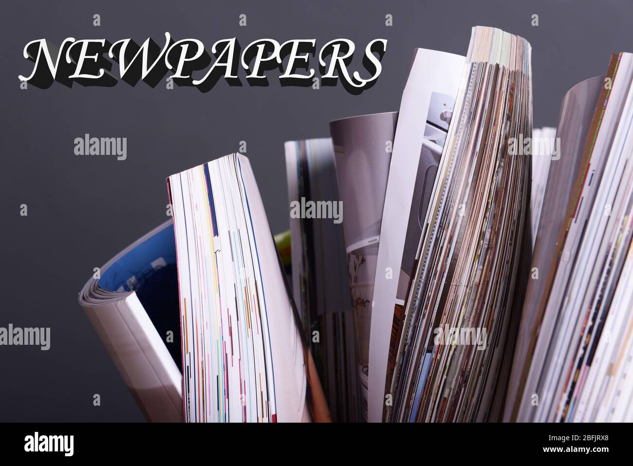 Magazines on gray background Stock Photo - Alamy
