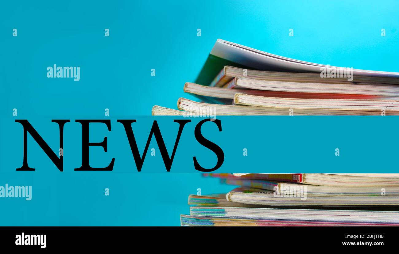 Stack of magazines on blue background Stock Photo - Alamy