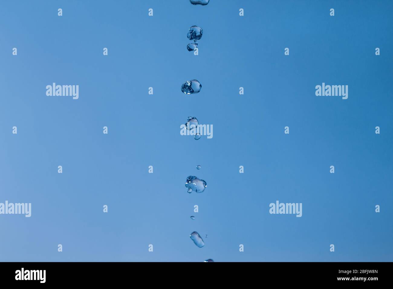 Water bubbles in the blue sky. Water drops on blue background. Aqua ...
