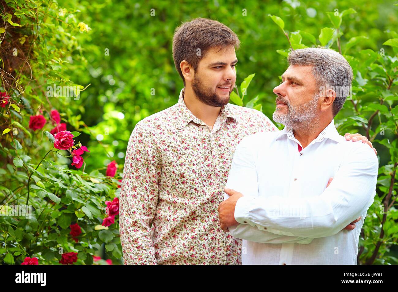 portrait of happy father and son, which are similar in appearance Stock ...