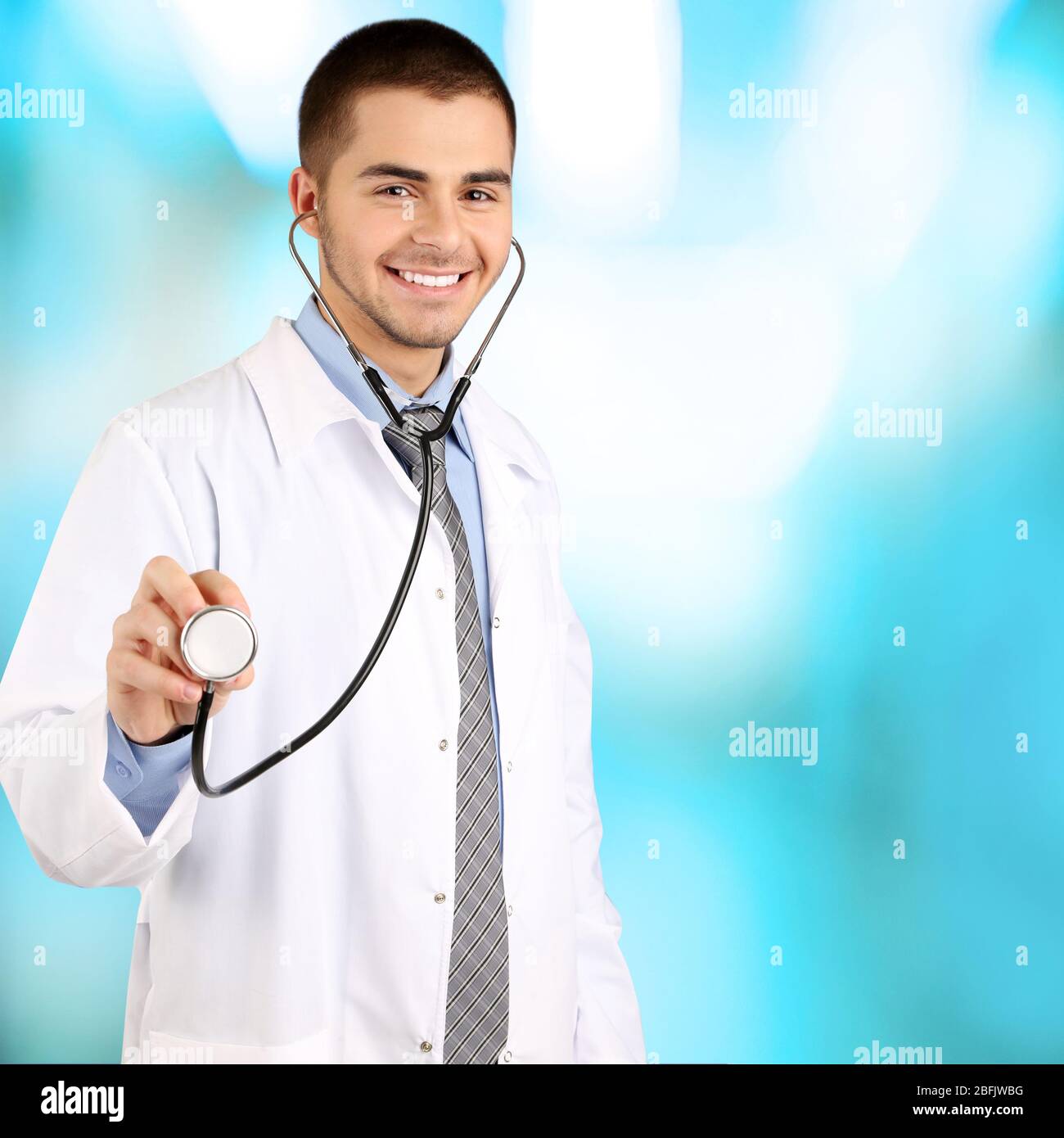 Male Doctor on hospital background Stock Photo - Alamy