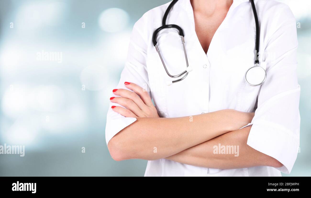 Doctor with stethoscope on hospital background Stock Photo - Alamy