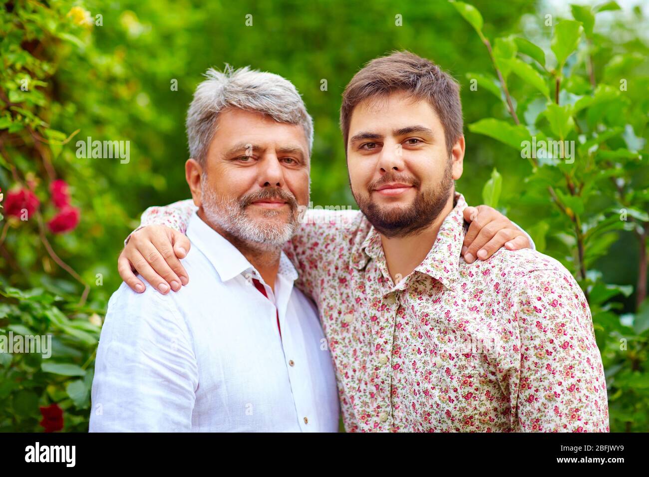 portrait of happy father and son, that are similar in appearance Stock ...
