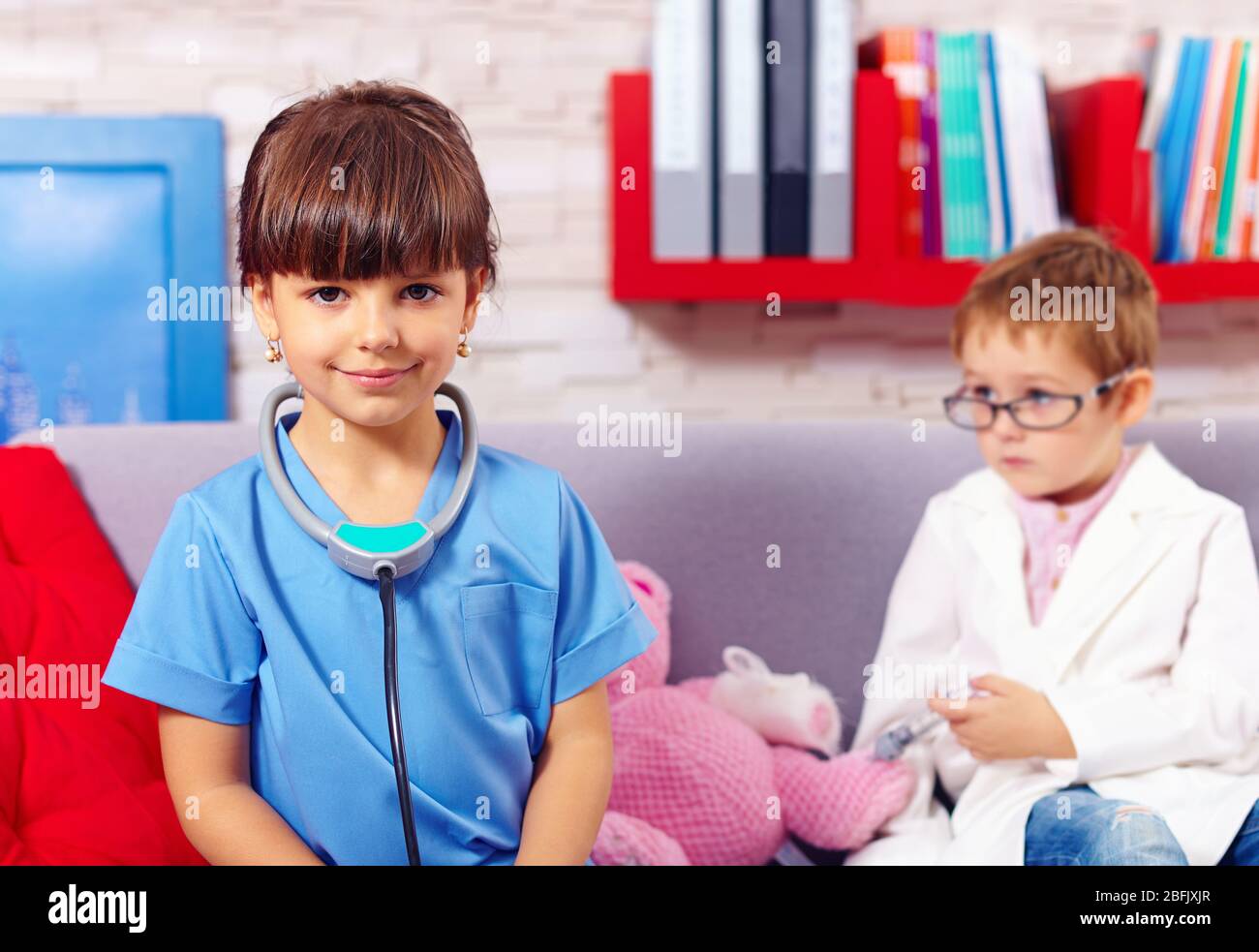 cute kids playing doctors with toys Stock Photo - Alamy