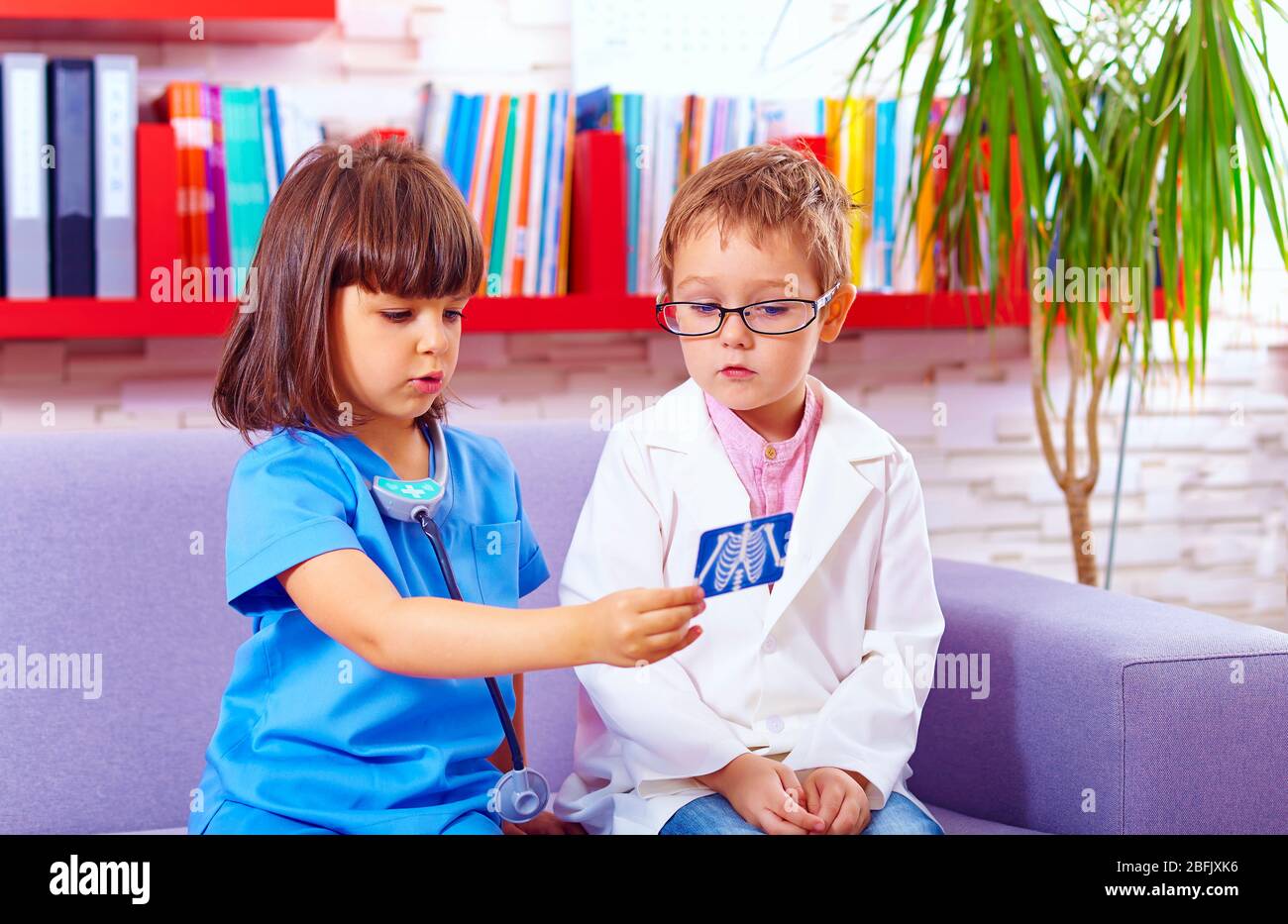 cute kids playing doctors in office Stock Photo - Alamy