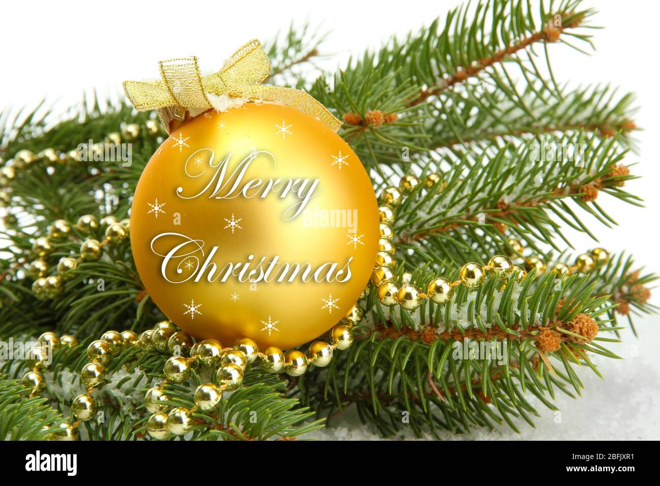 Christmas ball on fir tree with snow Stock Photo - Alamy